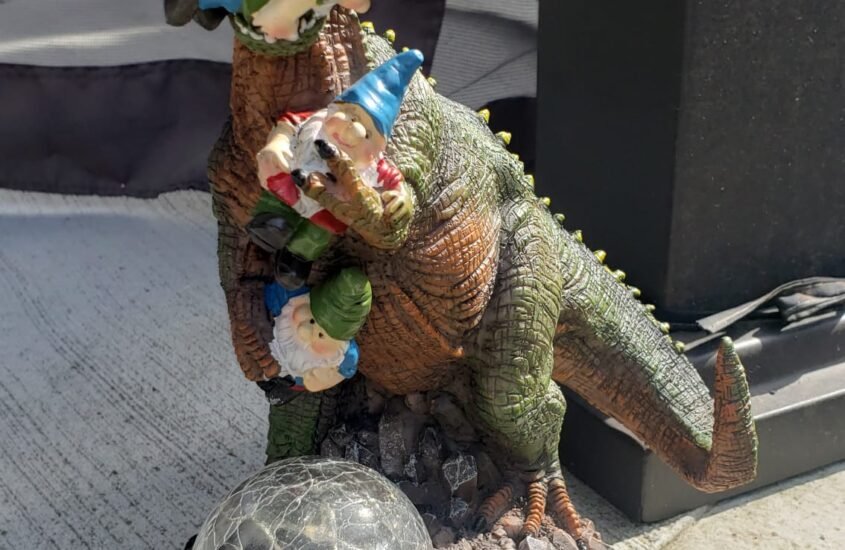 Dinosaur Eating Gnome with Light - The Gnome Shop
